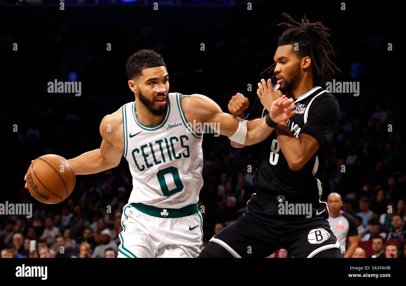 Boston Celtics forward Jayson Tatum (0) drives to the basket against ...
