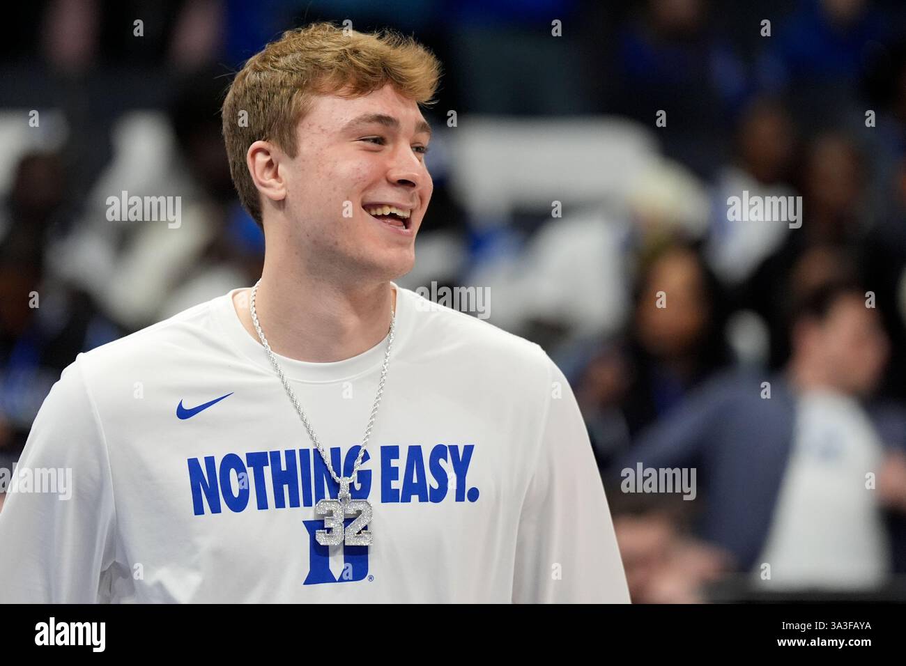 Duke forward Cooper Flagg smiles before an NCAA college basketball game ...