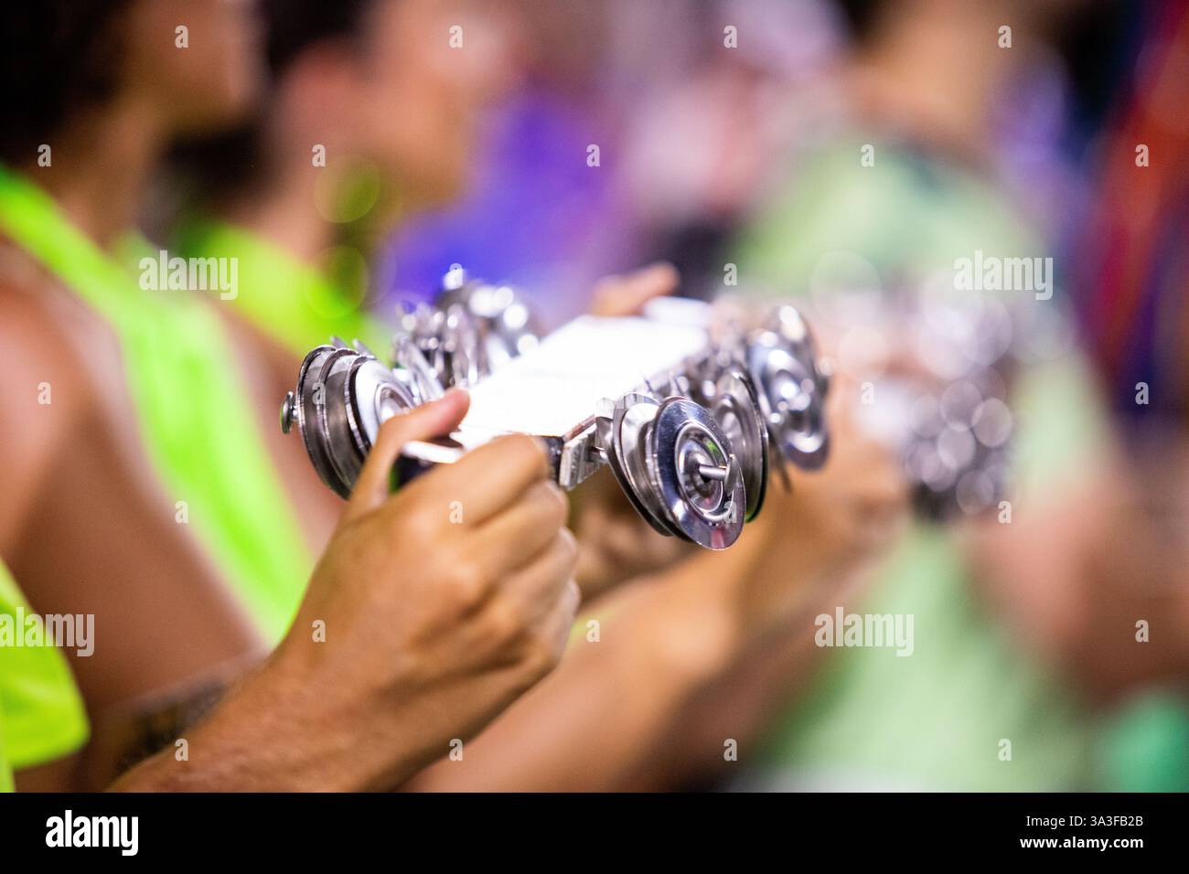 man playing percussion rattle during carnival in Rio de Janeiro, Brazil ...