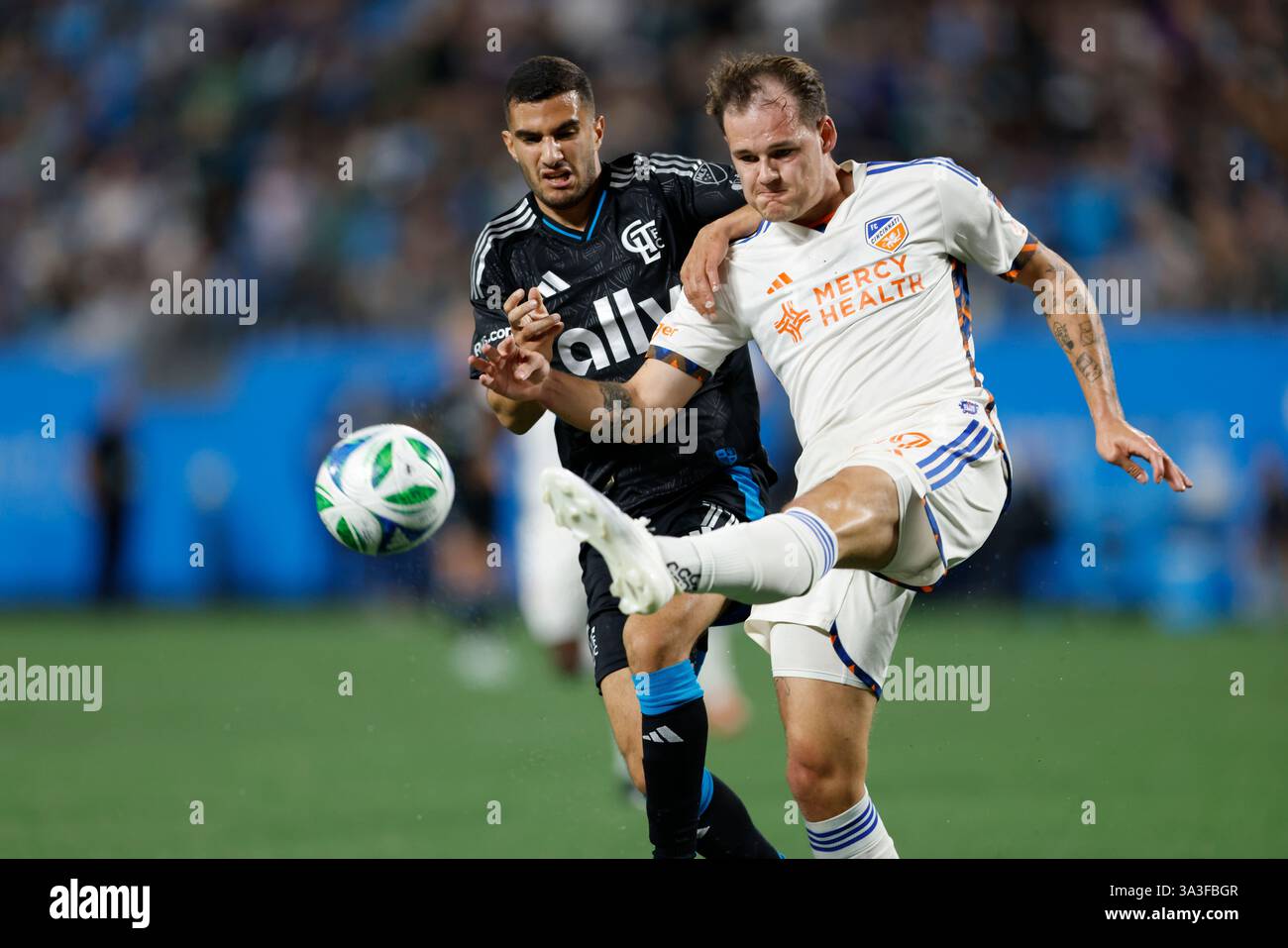 FC Cincinnati defender Lukas Engel, right, kicks the ball against ...