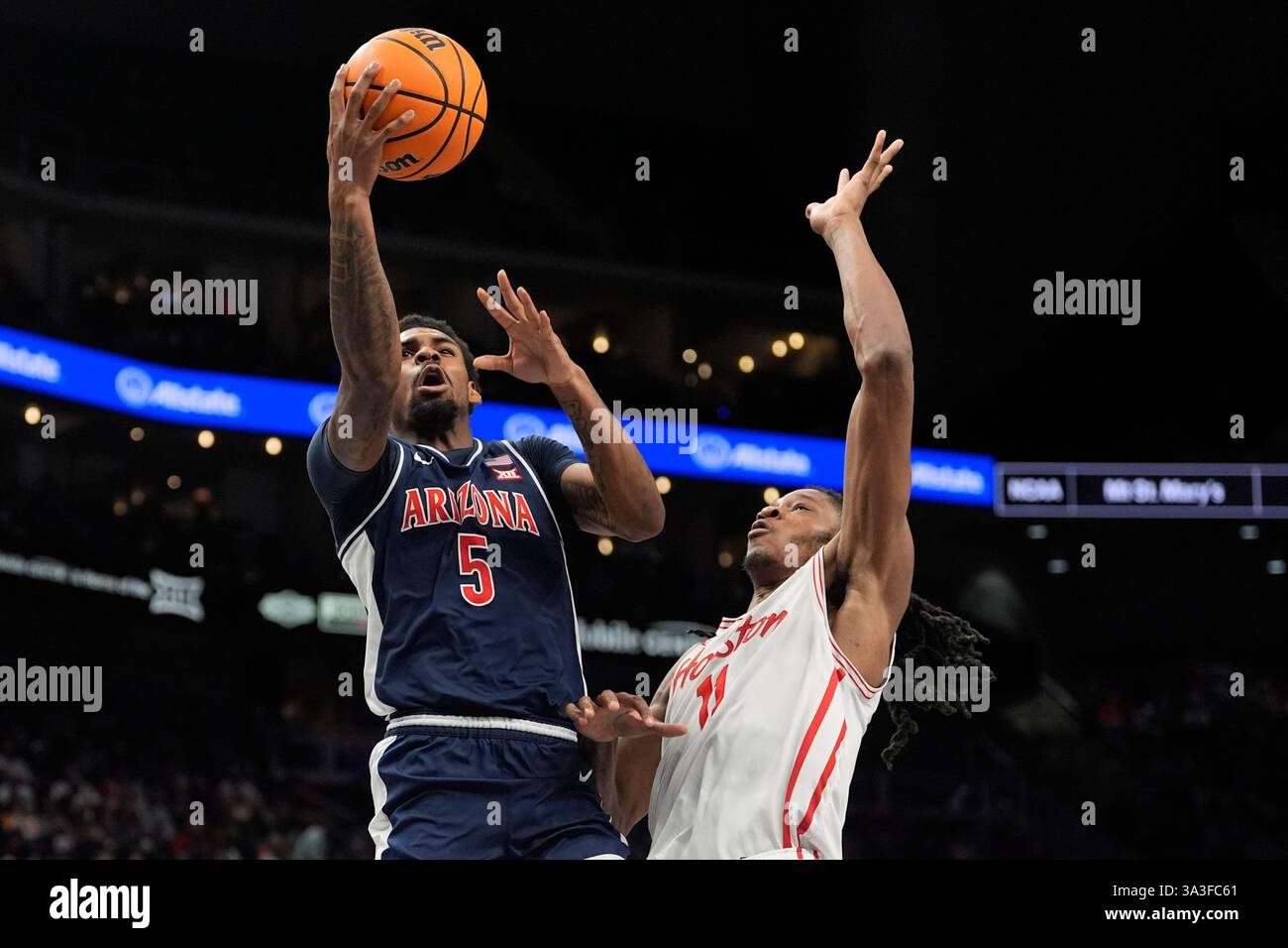 Arizona guard KJ Lewis (5) gets past Houston forward Joseph Tugler (11 ...