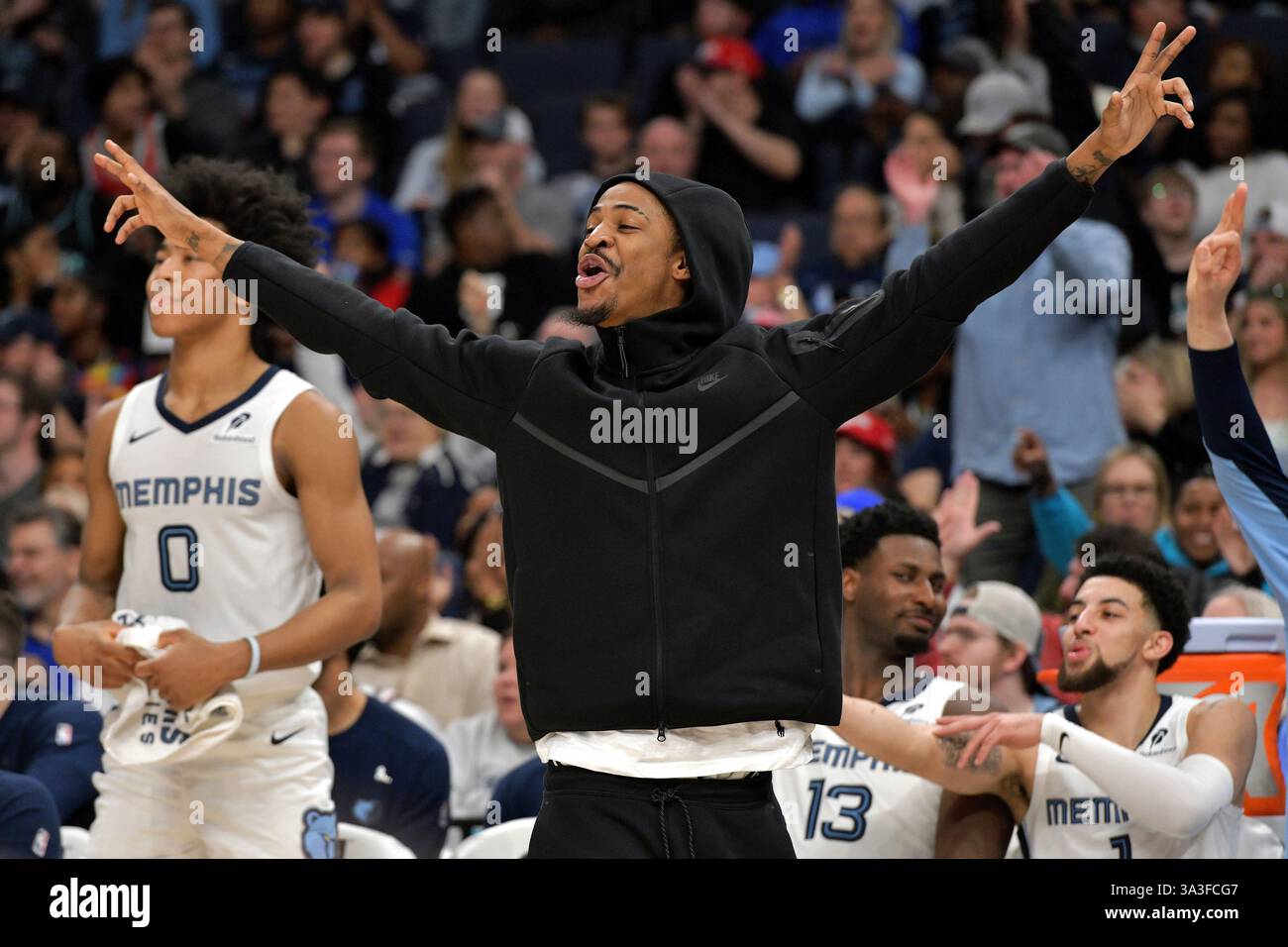Memphis Grizzlies guard Ja Morant, center, reacts from the sideline in ...