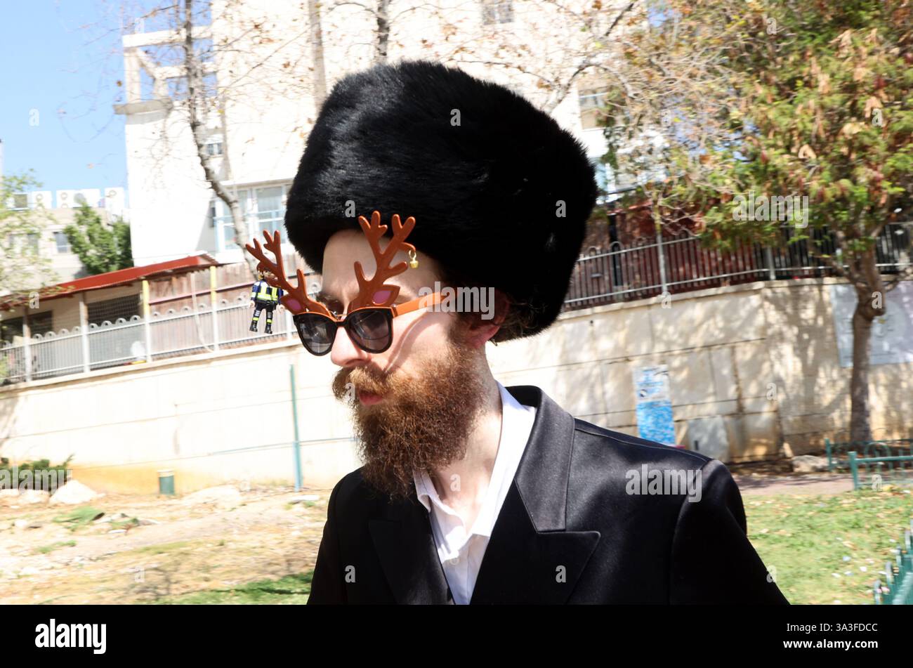 Beijing, China. 14th Mar, 2025. An Israeli takes part in a parade ...