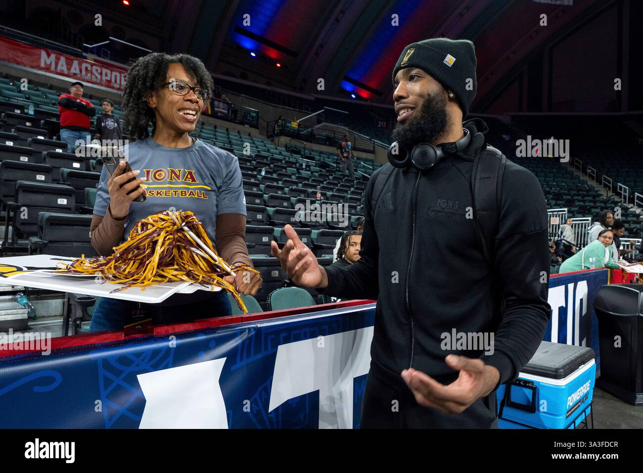 Iona's Jalen Barr, right, talks with his mom in the stands following ...