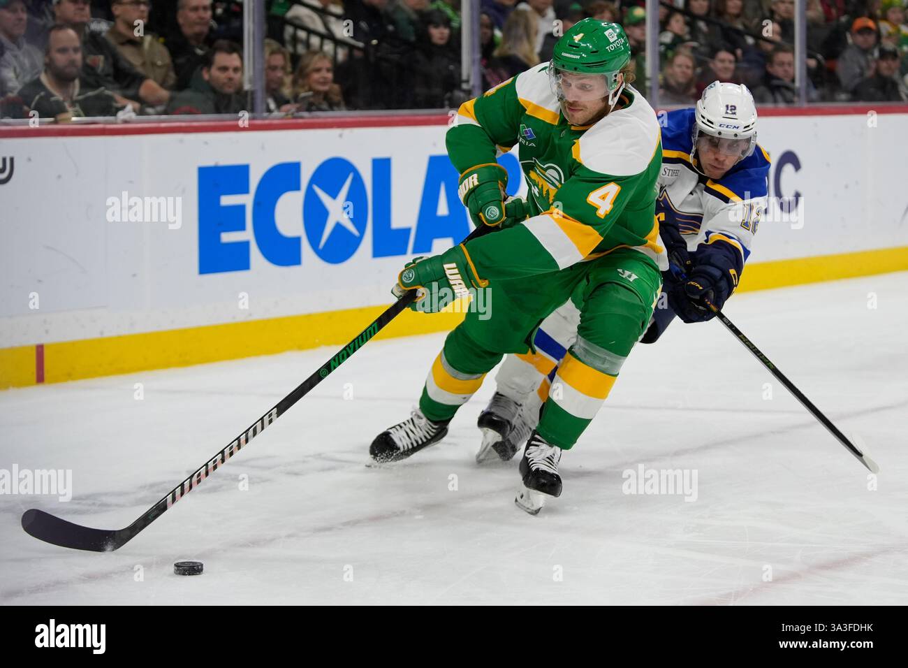 Minnesota Wild defenseman Jon Merrill (4) controls the puck as St ...