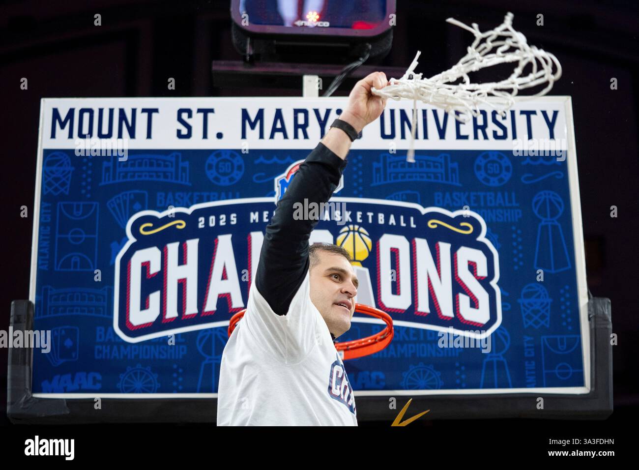Mount St. Mary's head coach Donny Lind waves the net after an NCAA ...