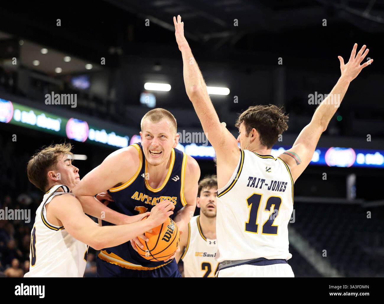 UC Irvine center Bent Leuchten, center, guards the ball from UC San ...