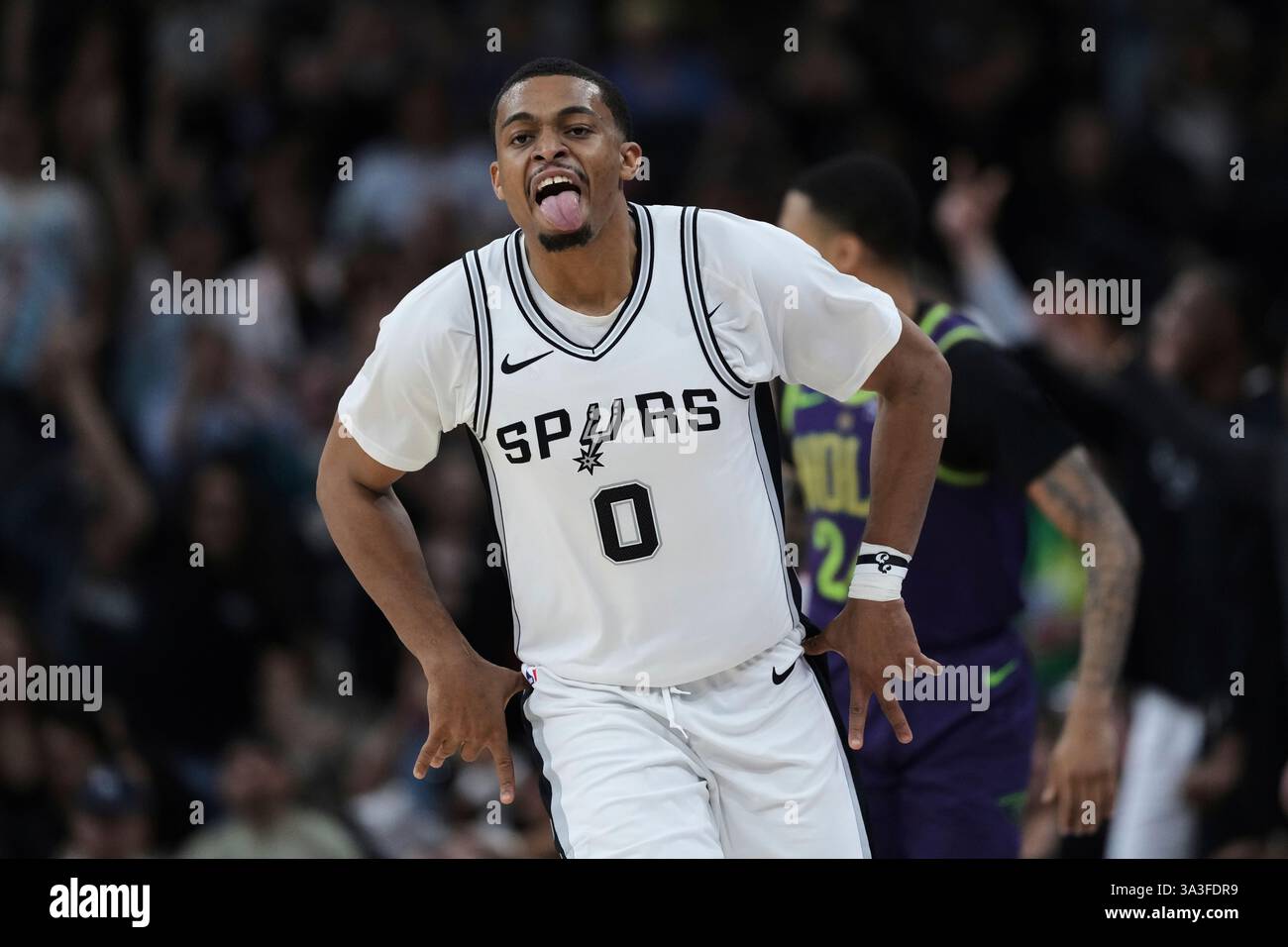 San Antonio Spurs forward Keldon Johnson (0) celebrates a score against ...