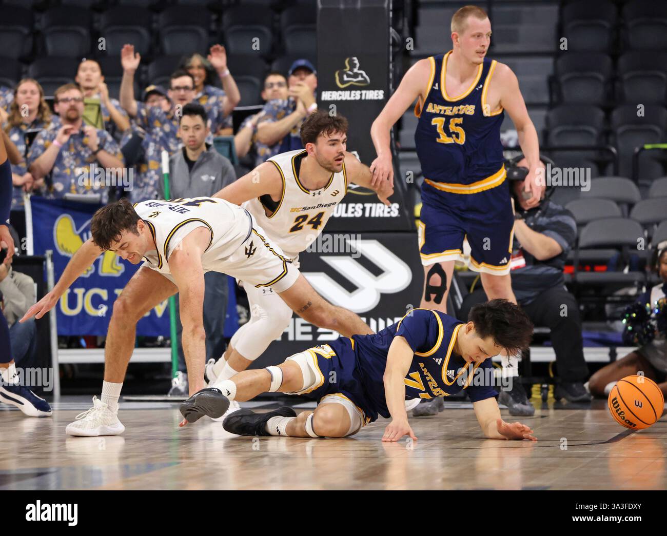 UC San Diego guards Aniwaniwa Tait-Jones, left, and UC Irvine guard ...