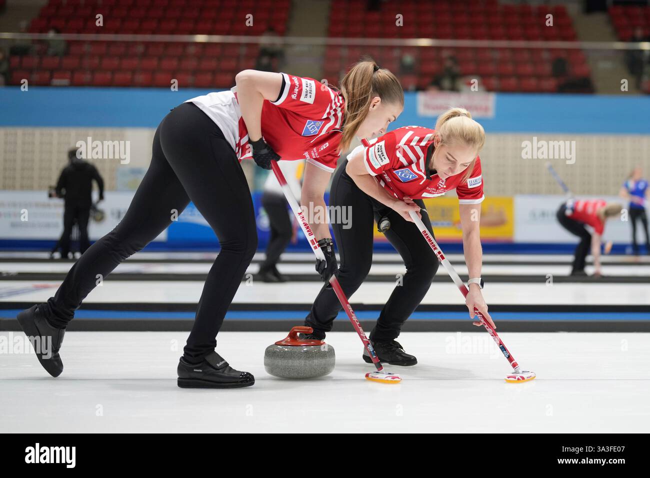 Denmark's Denise Dupont, right and Denmark's My Larsen, left, sweep ...