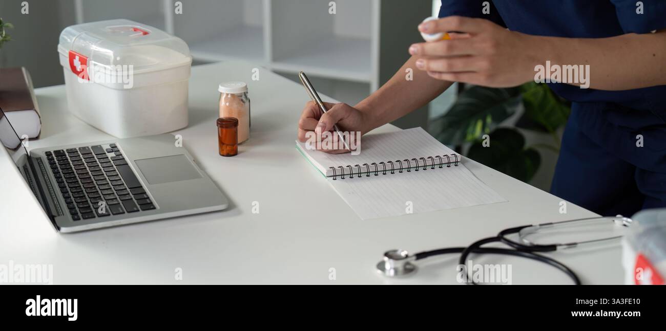 Medical Student and Patient Care. A focused medical student documenting ...