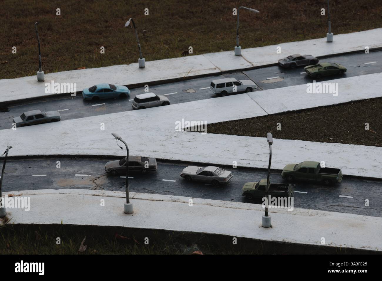 A realistic model traffic scene with miniature cars carefully placed on ...