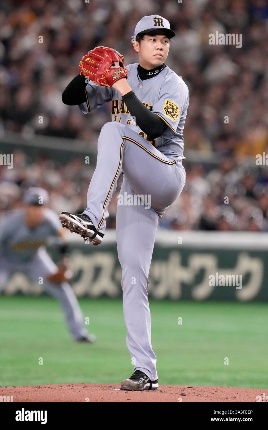 Hanshin Tigers pitcher Hiroto Saiki works against the Los Angeles ...