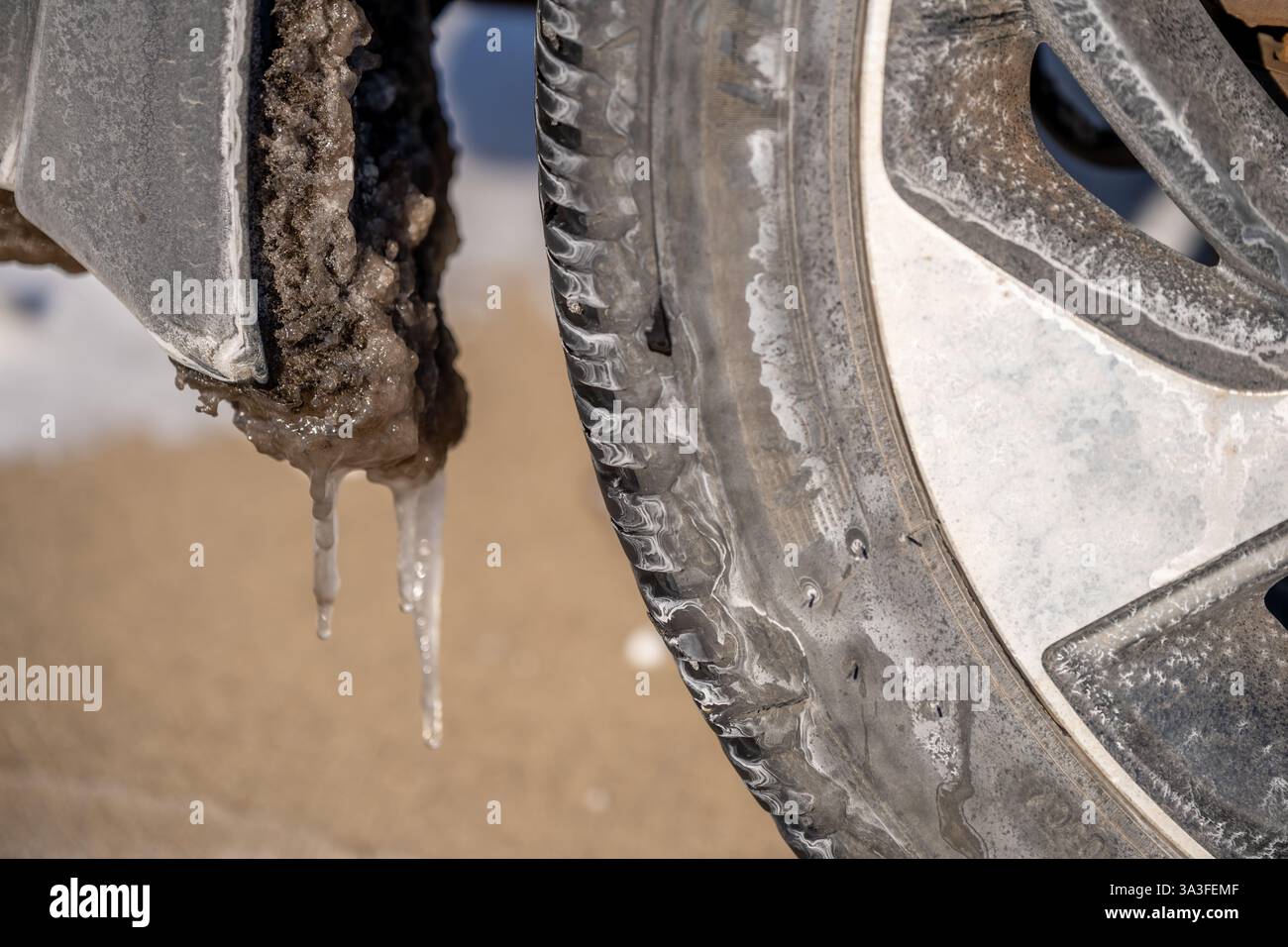 built up ice and snow on the rear tire wheel-well Stock Photo - Alamy