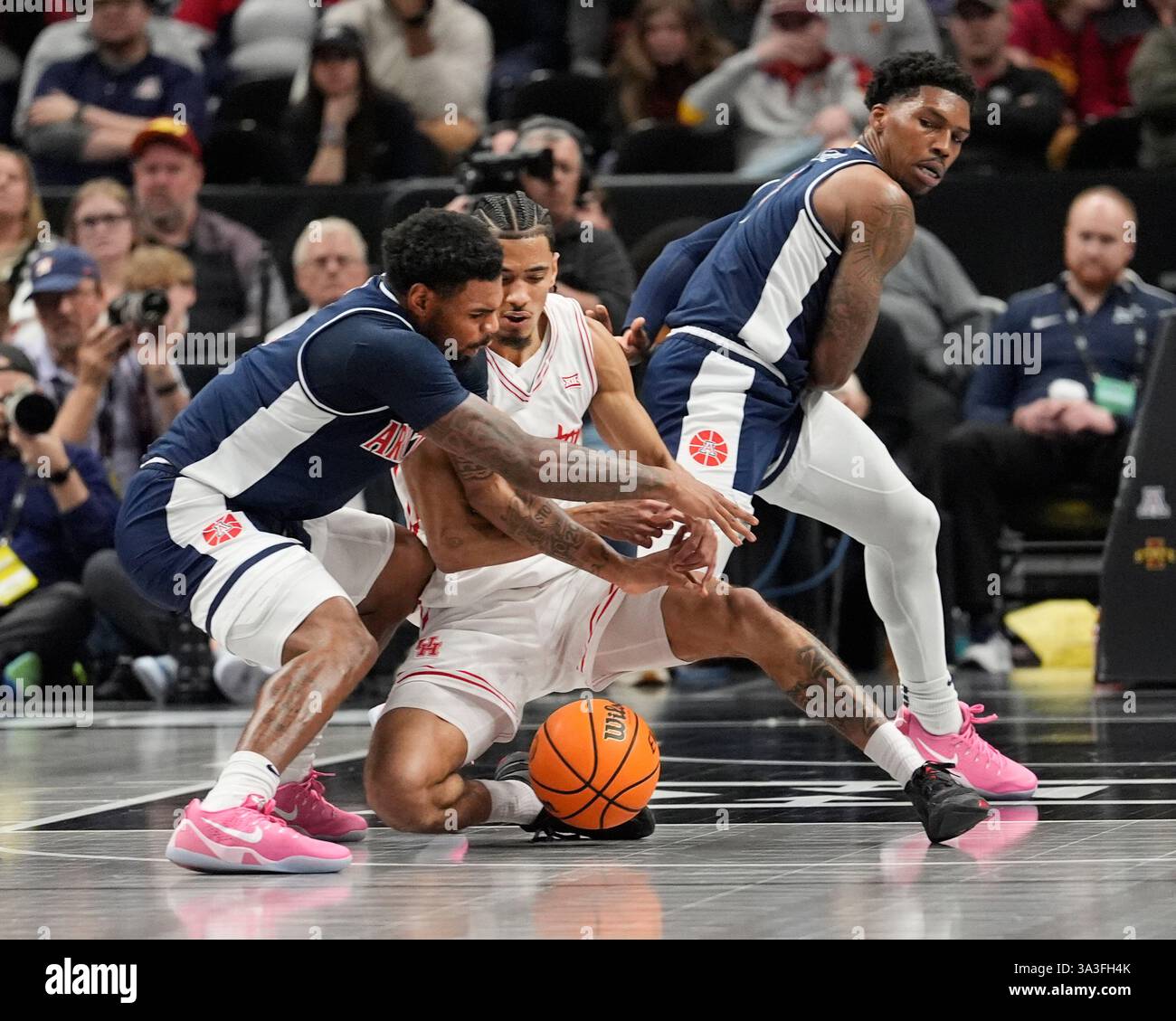 MAR 15 2025: Houston Cougars guard Milos Uzan (7) battles with Arizona ...