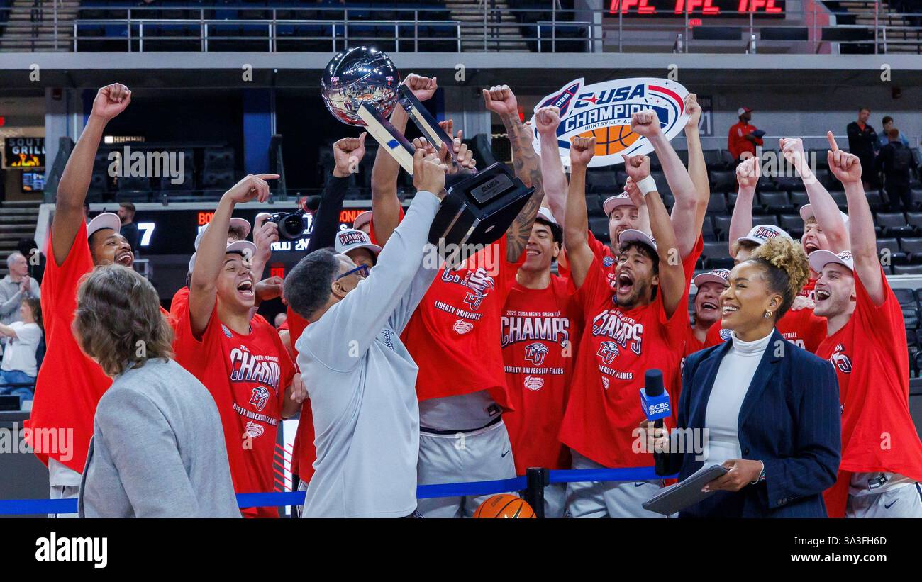 Liberty head coach Ritchie McKay, center left, hoists the trophy after ...