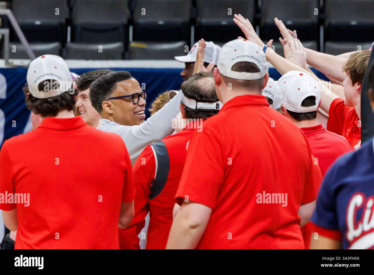 Liberty head coach Ritchie McKay, center left, high-fives the team's ...