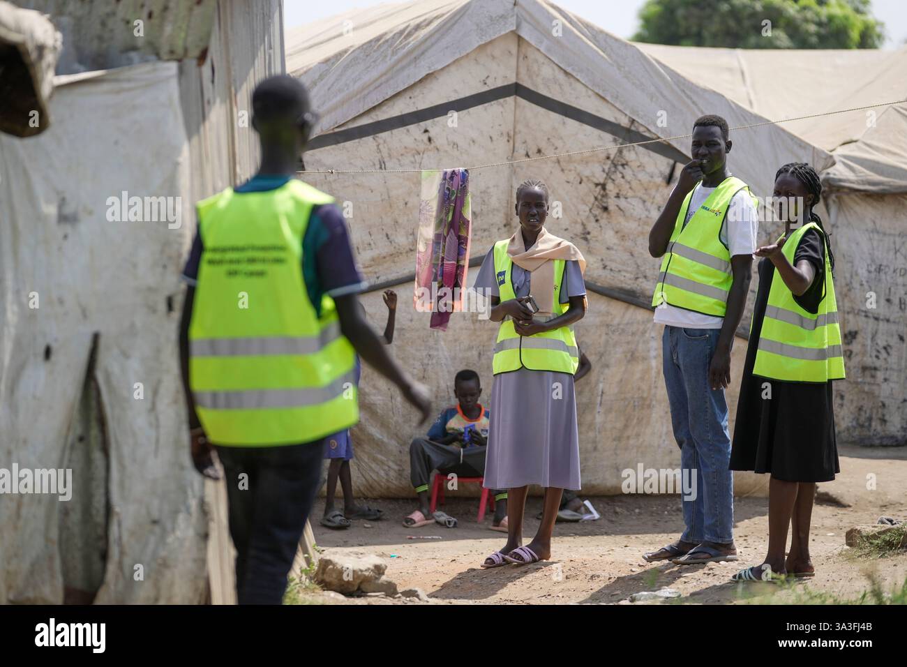 Volunteers and workers of Israel-based organization (IsraAID) walk in ...