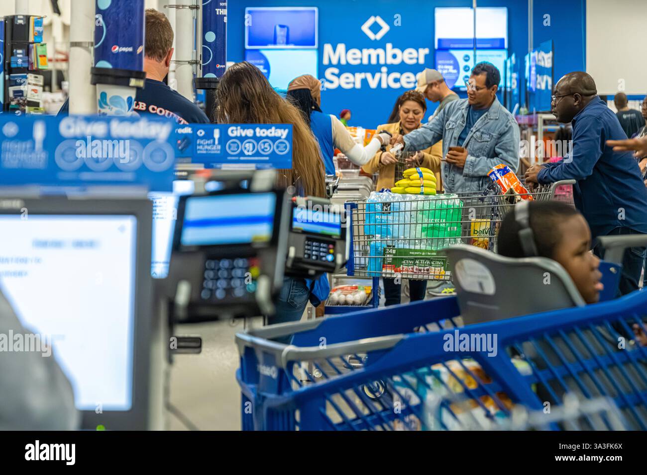 Shoppers checking out at Sam's Club, a membership warehouse store, in ...