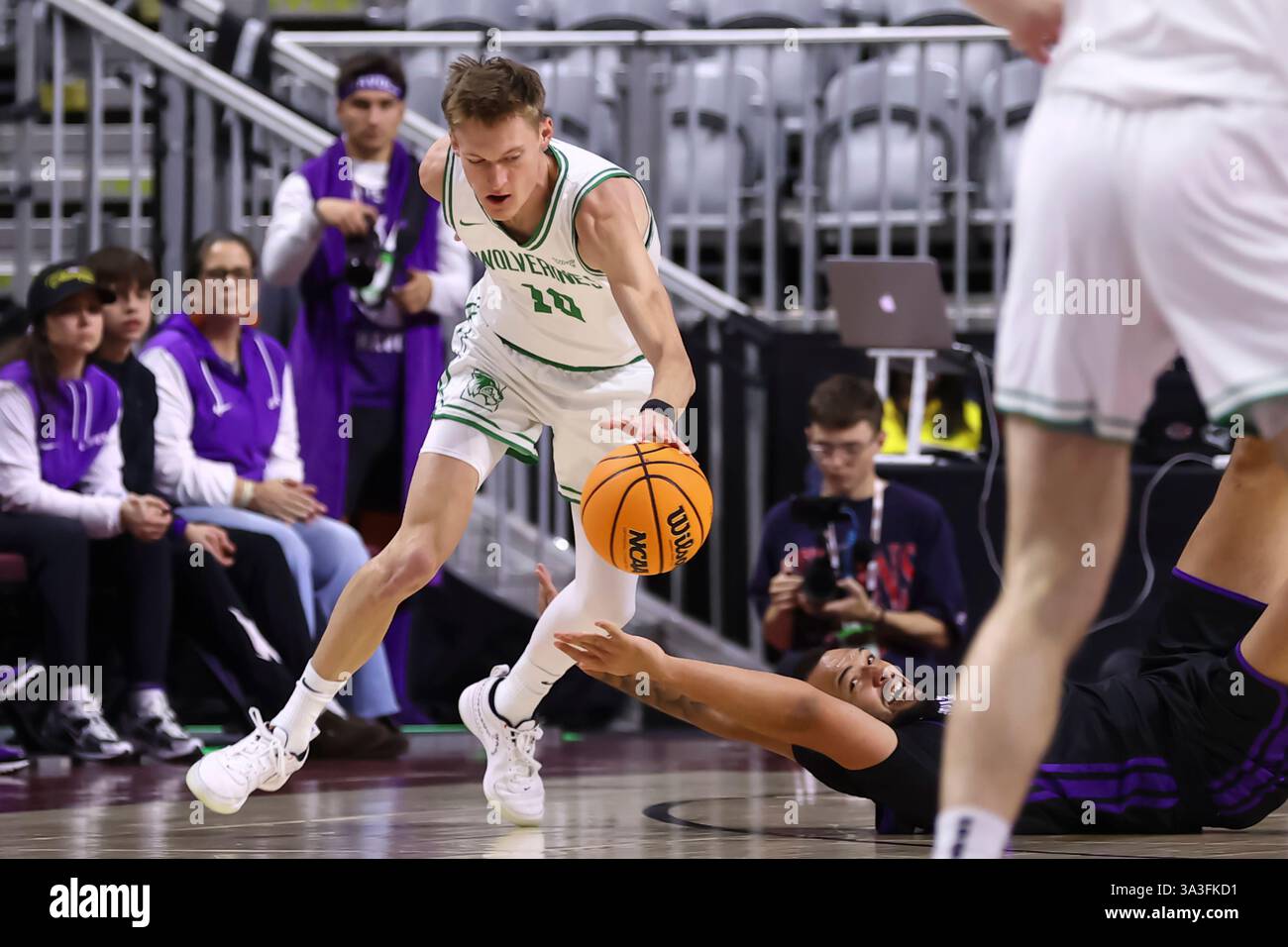 Utah Valley guard Trevan Leonhardt (10) gets to a loose ball against ...