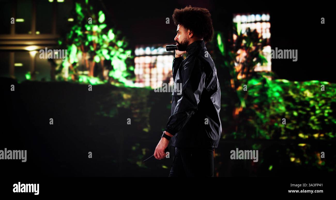 Late Night Patrol: African American Security Guard Monitoring Building ...