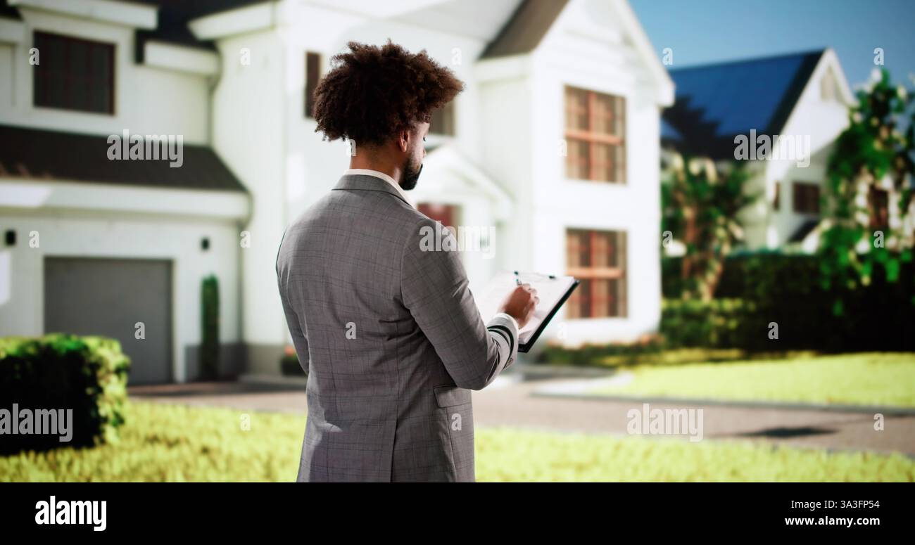 African American Real Estate Agent inspecting house for appraisal Stock ...