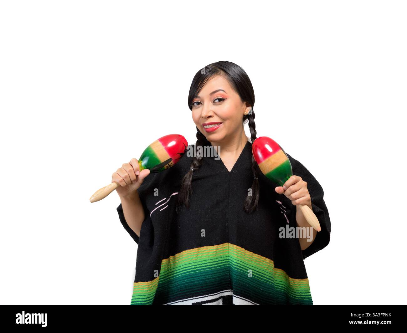 Mexican woman wearing colorful poncho plays maracas with positive ...