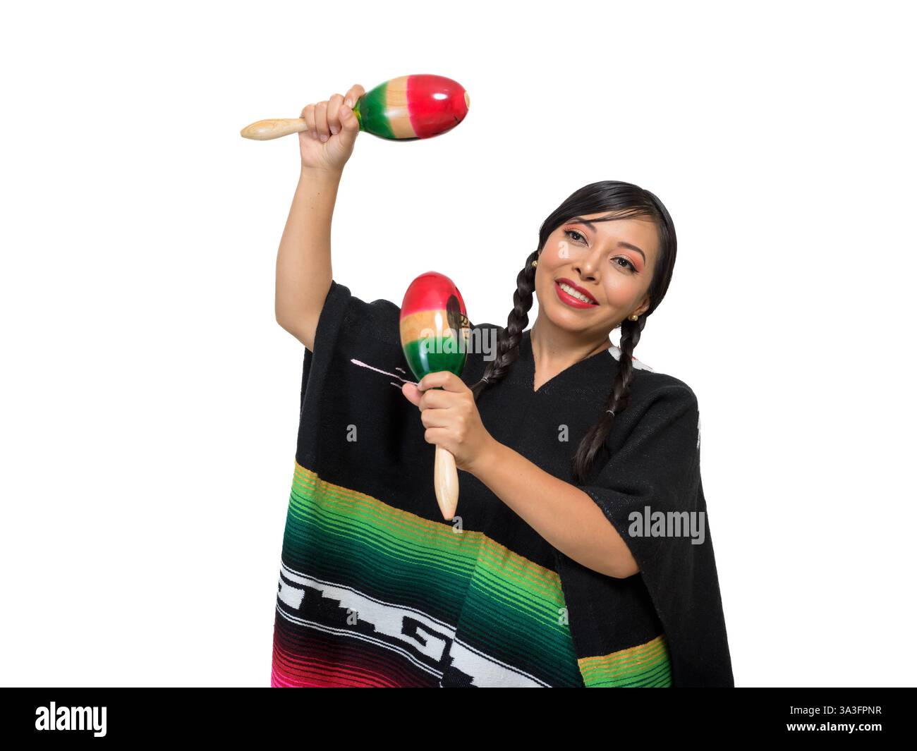 Mexican woman wearing colorful poncho plays maracas with positive ...