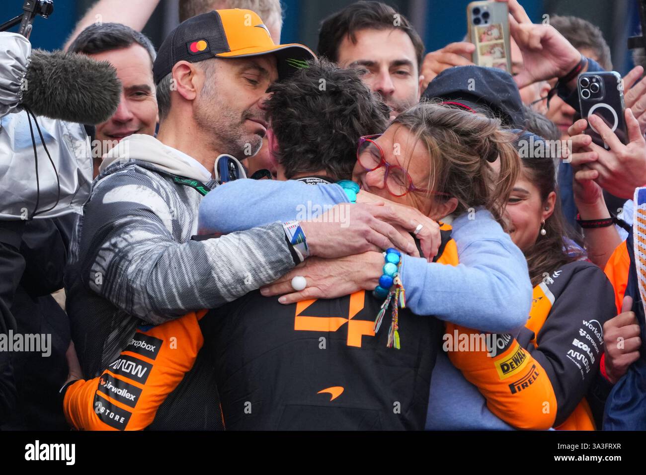 McLaren driver Lando Norris of Britain is congratulated by his father ...