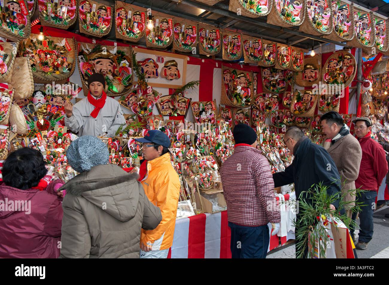 Visitors to Imamiya Ebisu Shrine pick out "mi" (Ebisu baskets) and ...