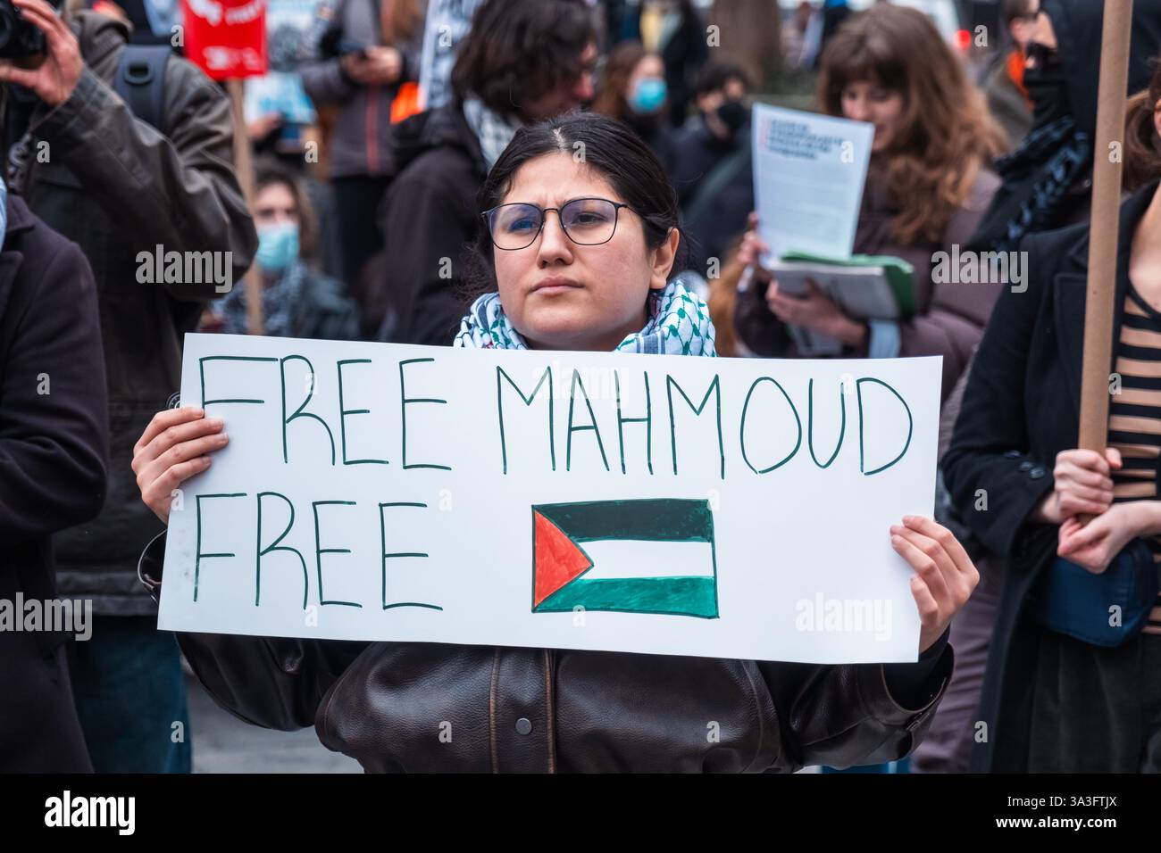 New York, USA. 15th Mar, 2025. A protester holds a placard that says ...
