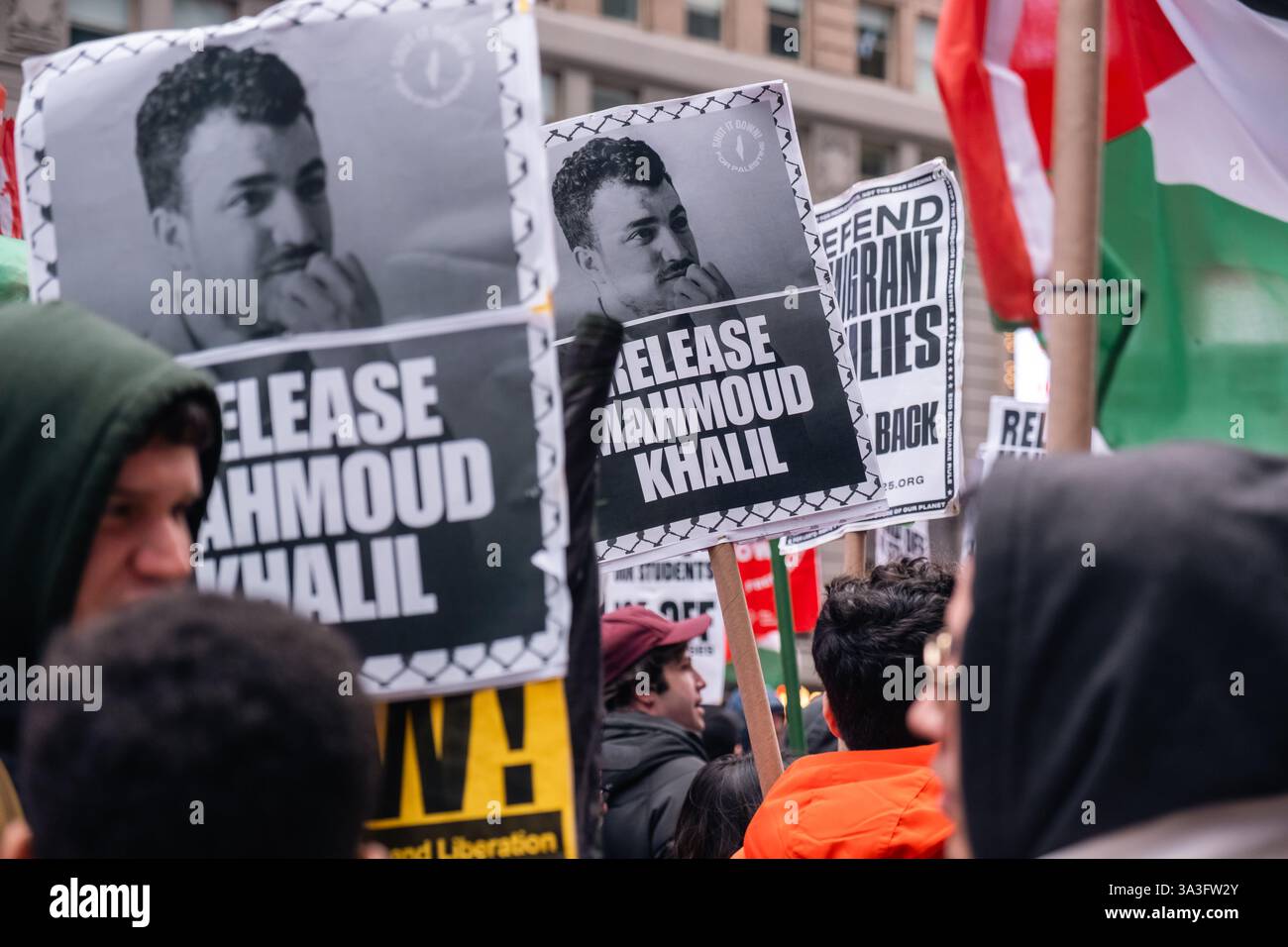Protesters hold placards expressing their opinion at in Times Square ...