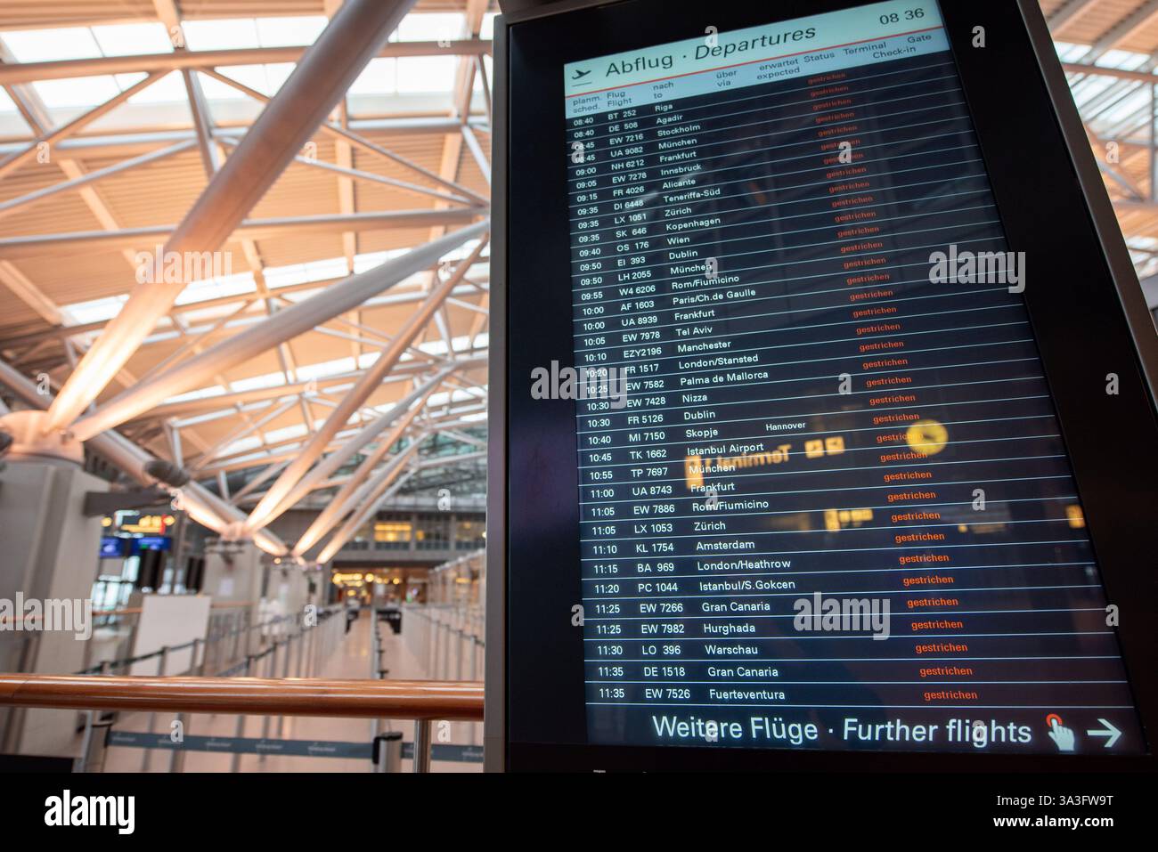 Germany, 10 March 2025 - Display board with cancelled flights in front ...
