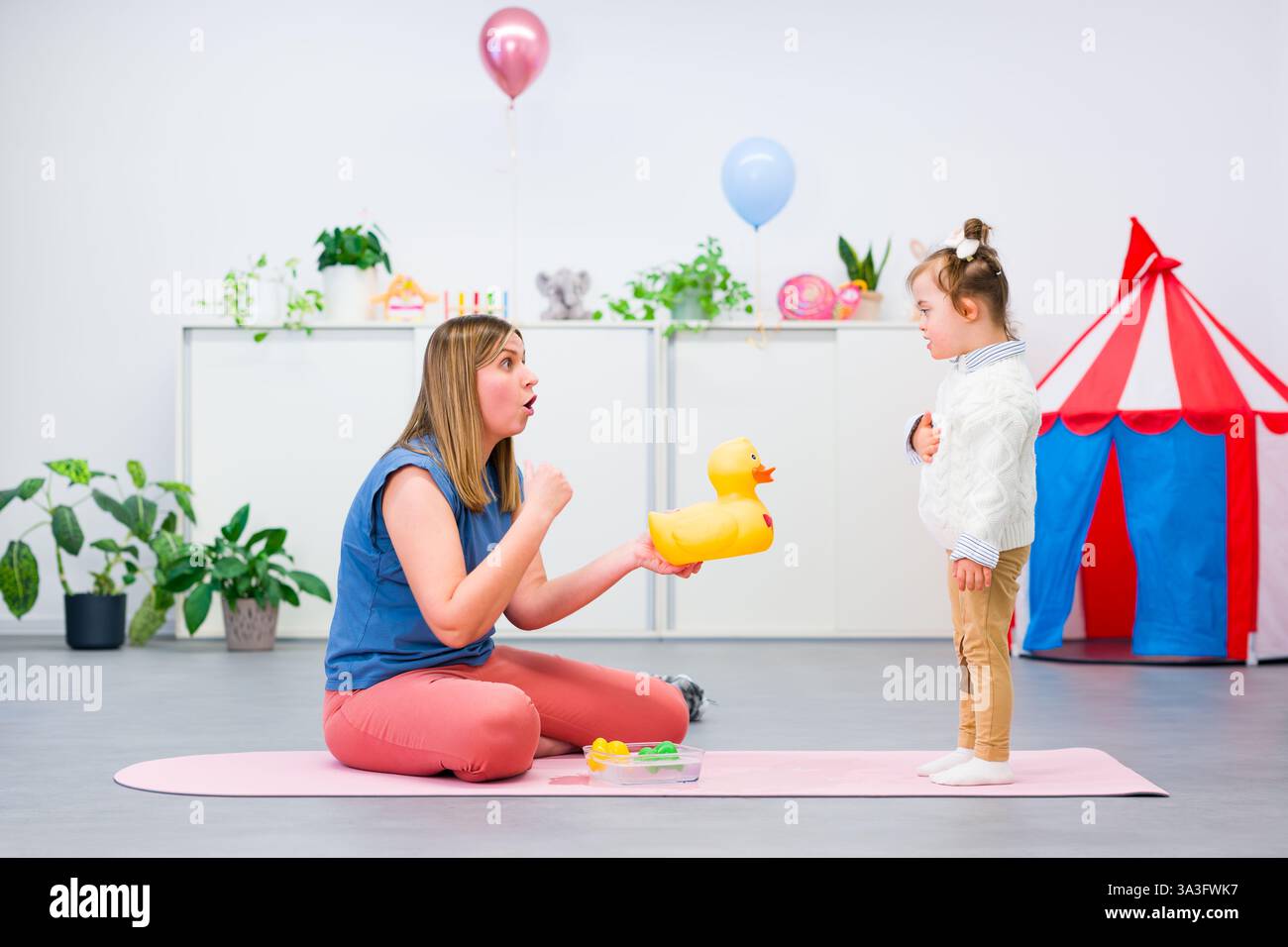 Nonverbal child with Down syndrome learning baby sign language with the ...