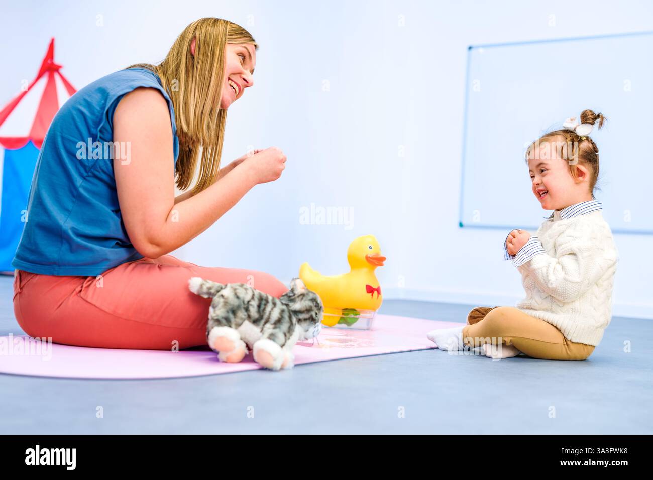 Nonverbal child with Down syndrome learning baby sign language with the ...
