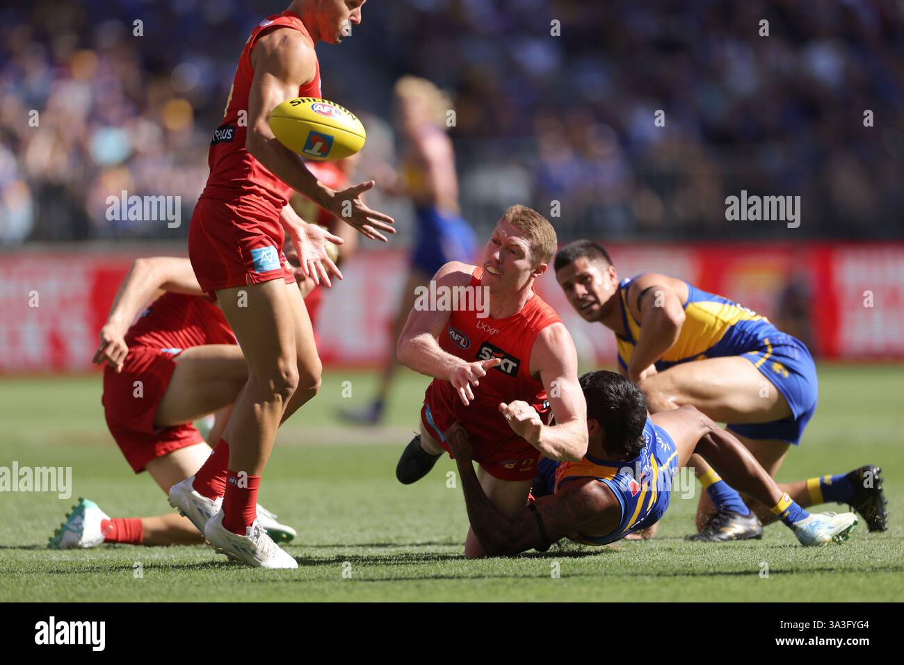 Matt Rowell of the Suns handballs during the AFL Round 1 match between ...
