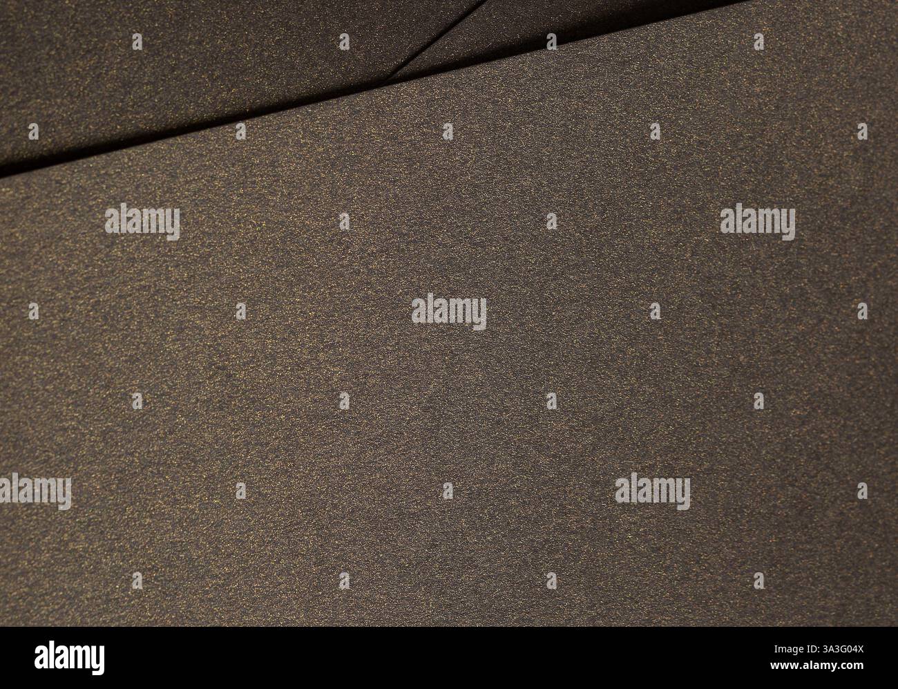 Elegant brown paper texture with a golden shimmering finish and subtle ...