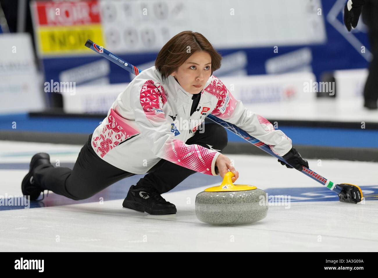 Japan's skip Sayaka Yoshimura releases the stone during the match ...