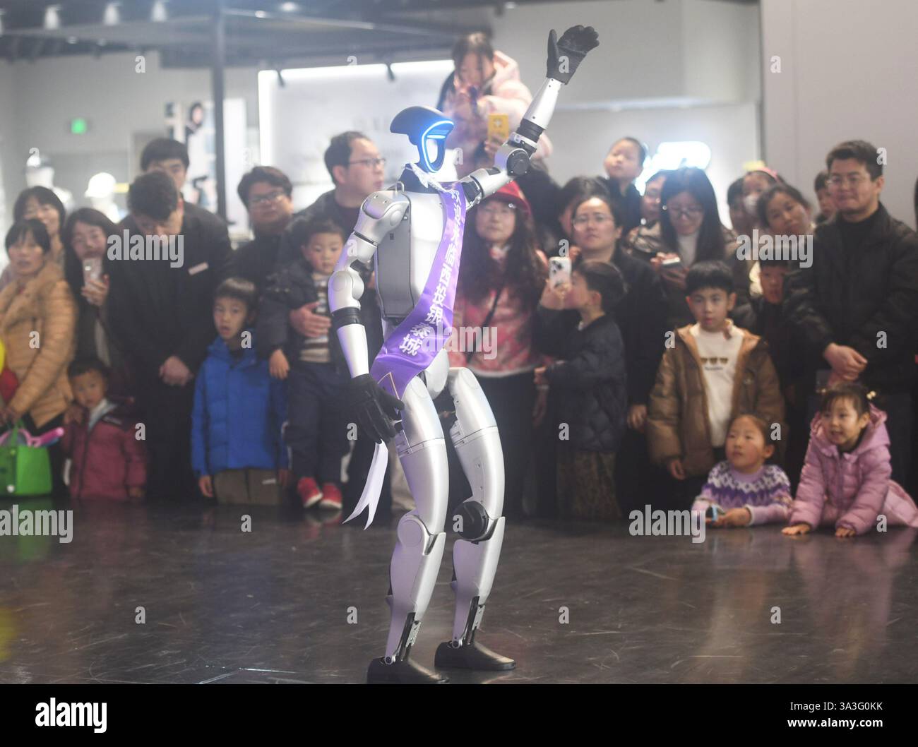 A Unitree G1 humanoid robot performs for the audience at a robot ...