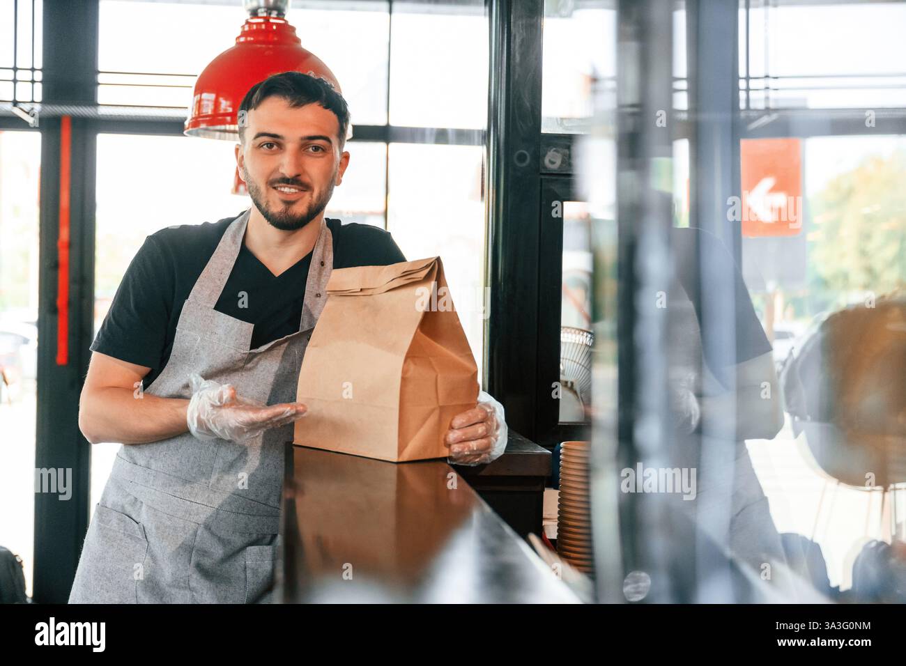 Man is serving delicious street food Stock Photo - Alamy