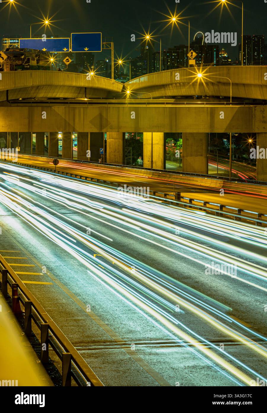 Bangkok, Thailand - Jan 10, 2025 - A nightscape view with bright glowing light trails effect of ...