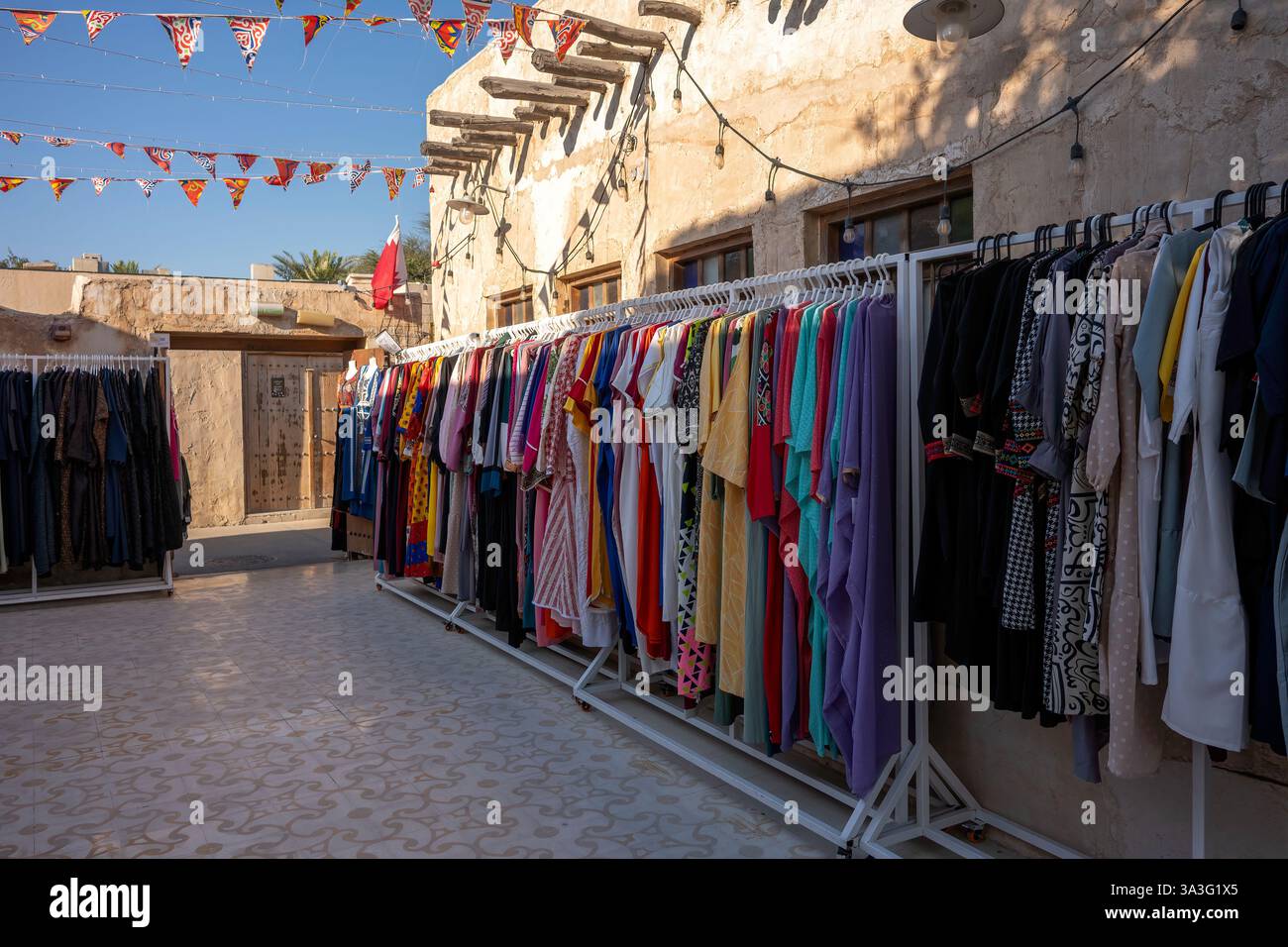 Traditional arabic abayas hi-res stock photography and images - Alamy