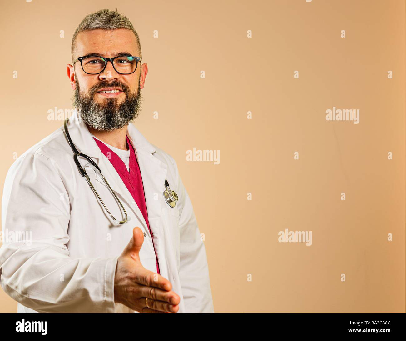 A smiling male cardiologist in a white coat with a stethoscope extends ...