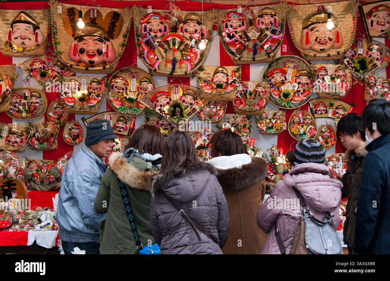 Visitors to Imamiya Ebisu Shrine pick out "mi" (Ebisu baskets) and ...