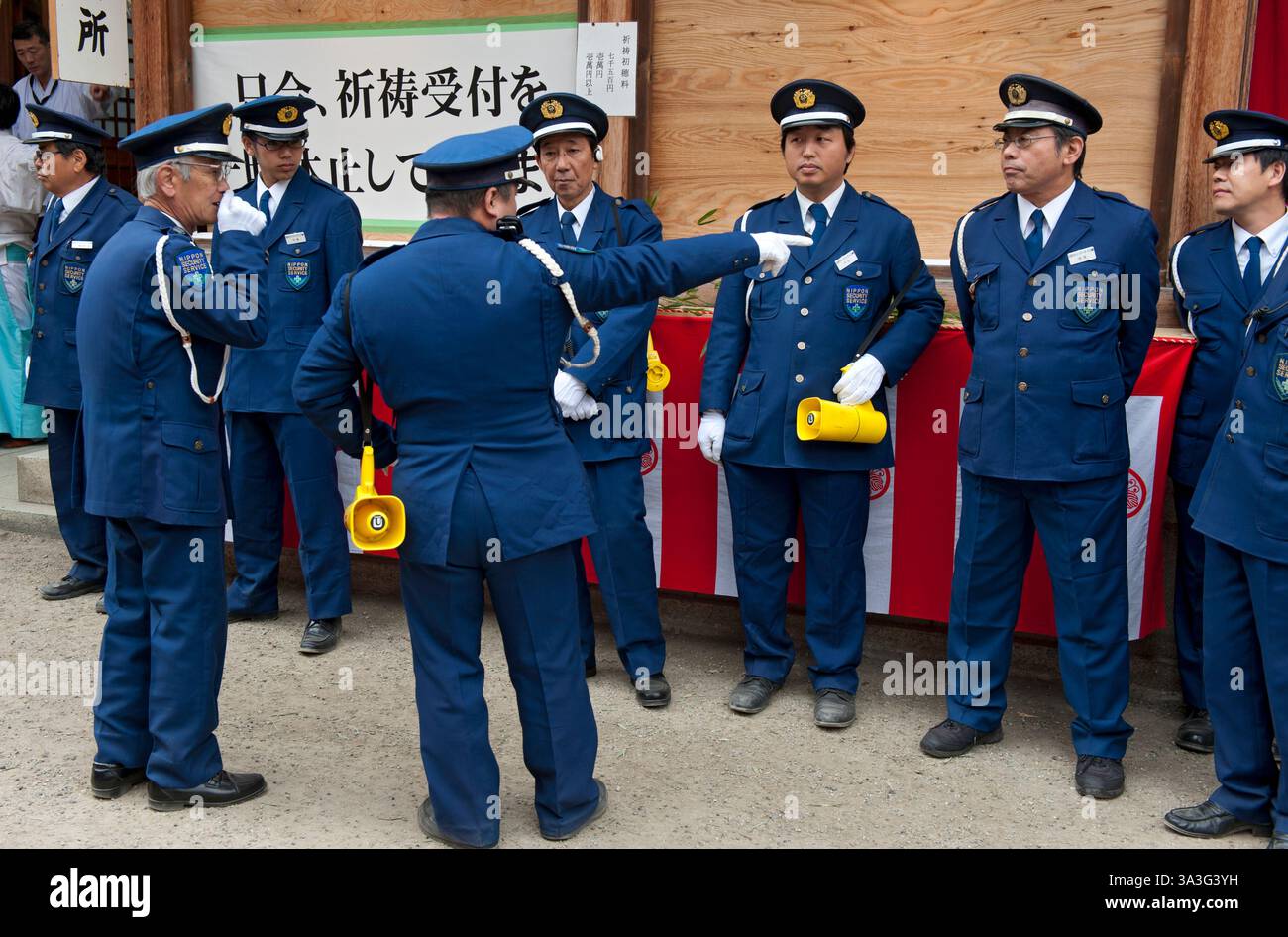 Group of Japanese law enforcement policemen in uniform having a meeting ...