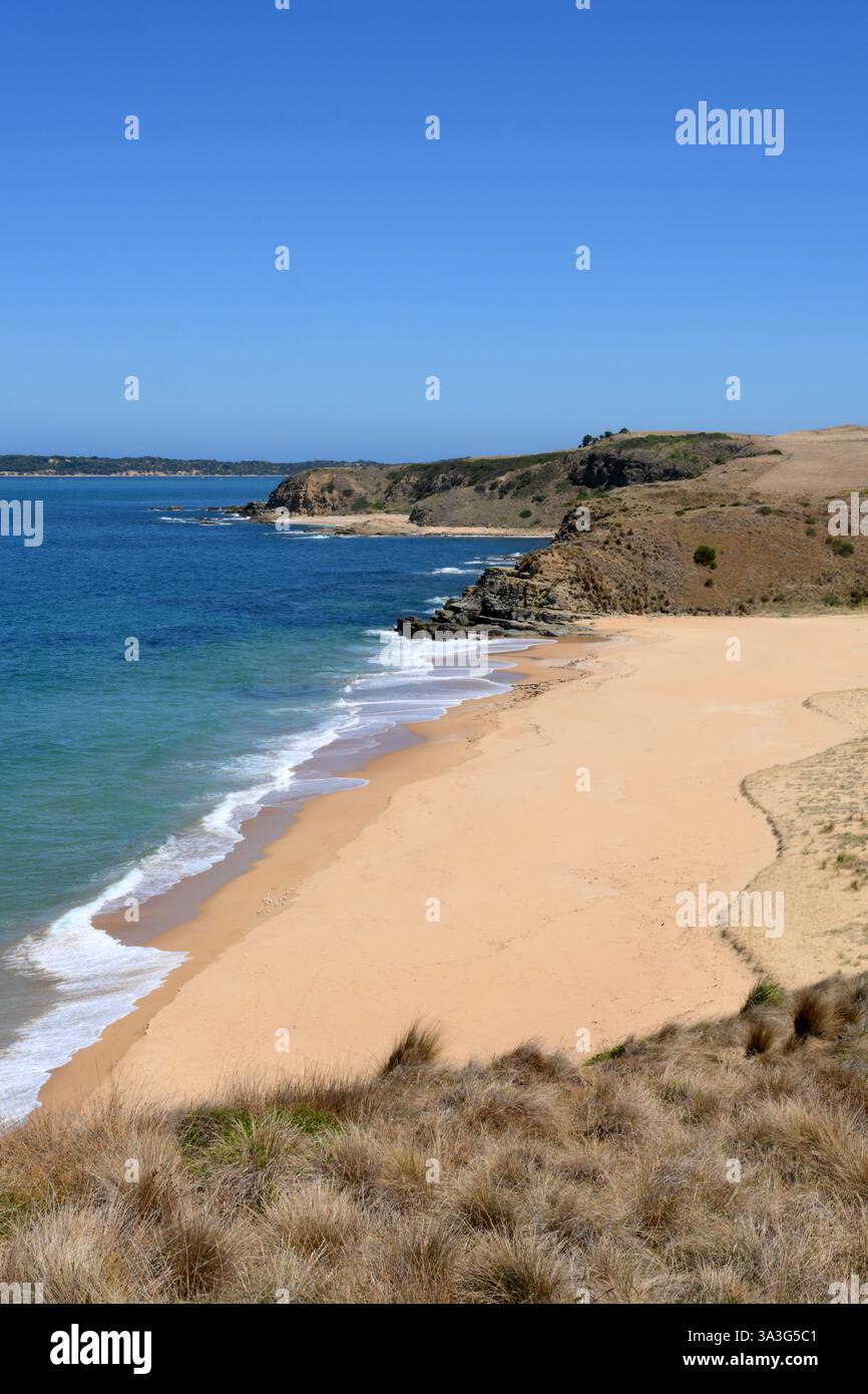 Clifftop view over the steep shoreline at Black Beach near San Remo ...
