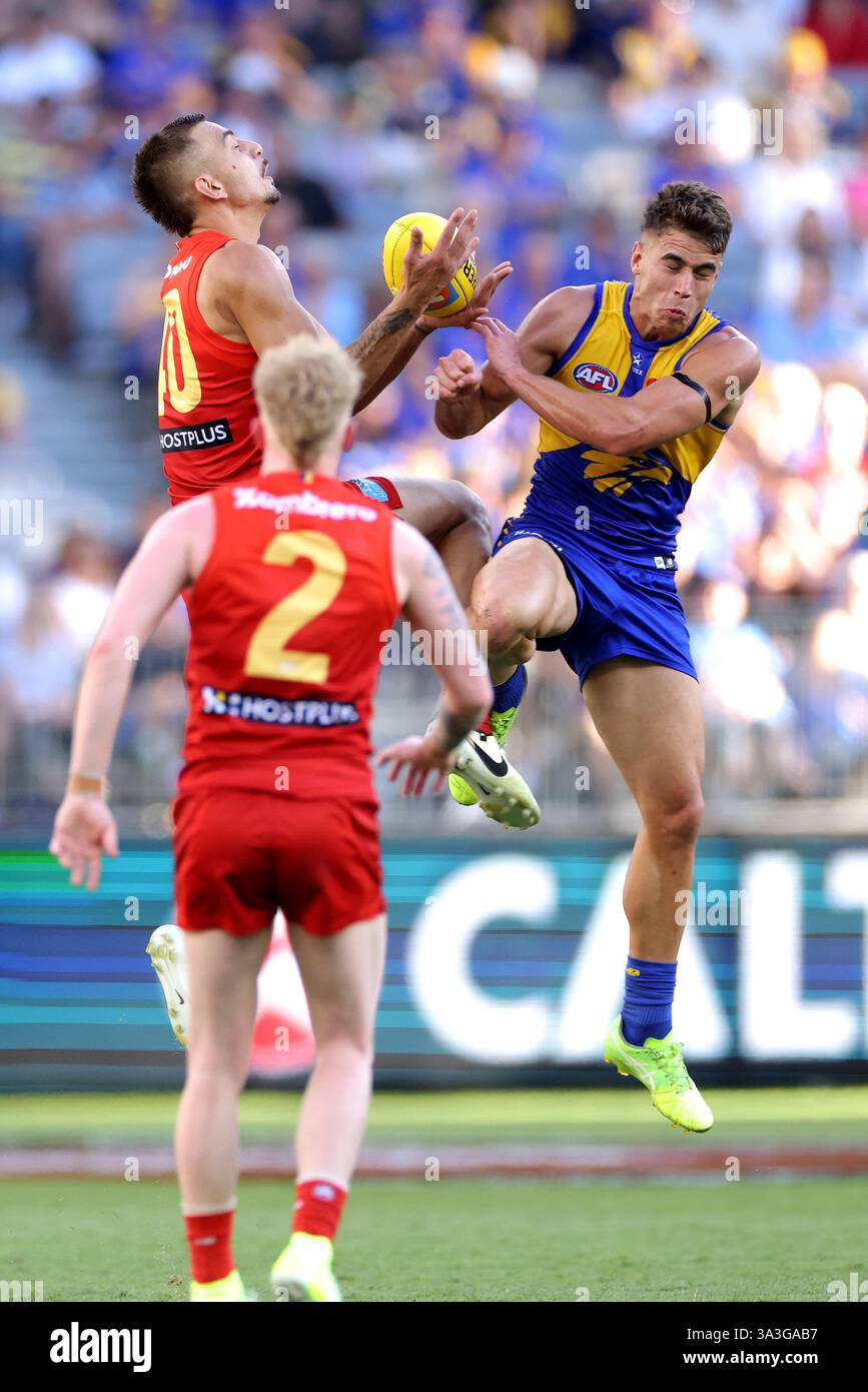 Perth, Australia. 16th Mar, 2025. Joel Jeffrey of the Suns and Elijah ...