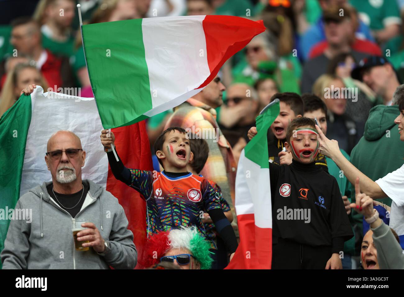 Rome, Italy - 15.03.2025: Italian little fans wave the tricolour flag ...
