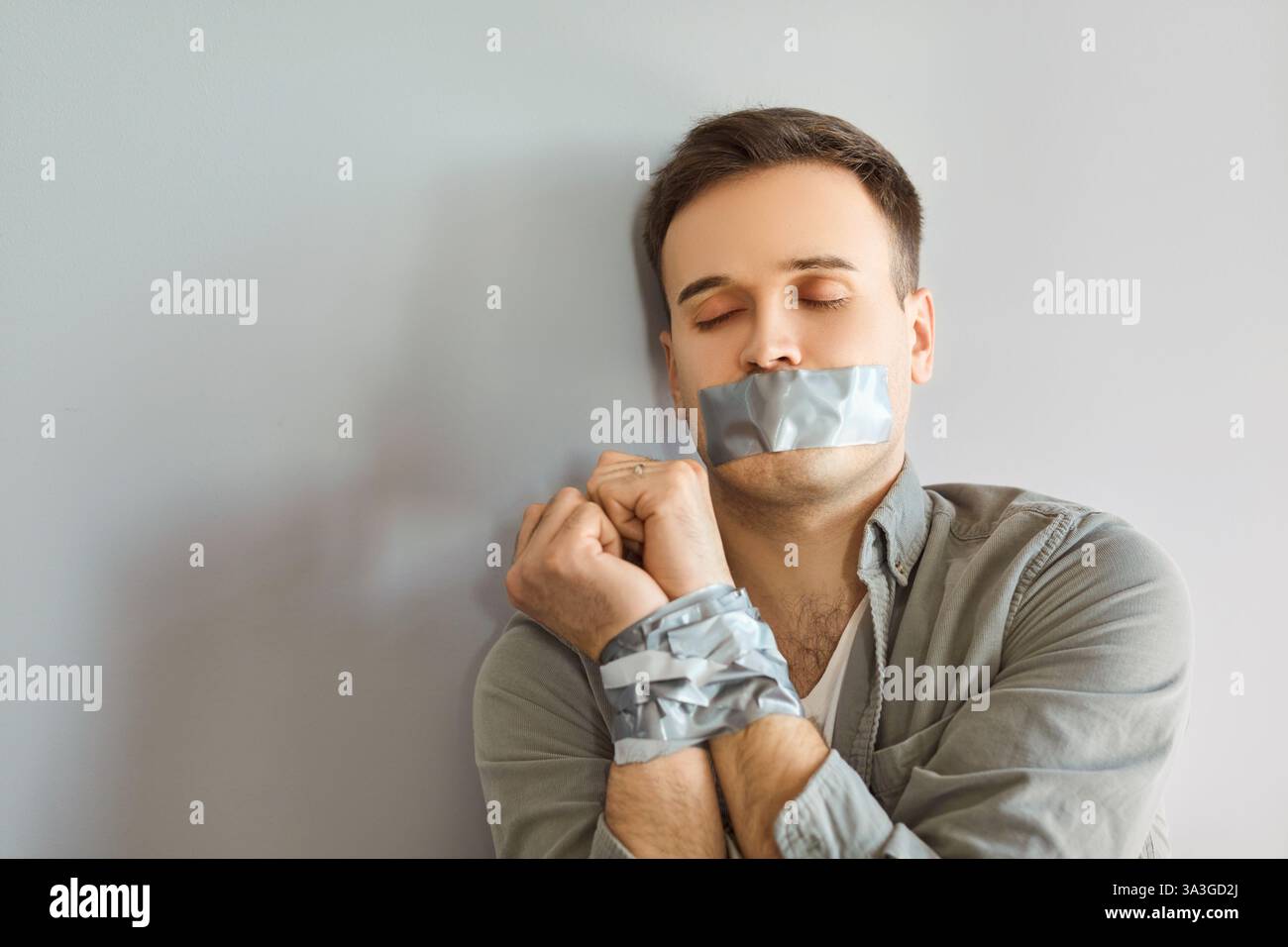 Unconscious Victim With Tied Hands And Taped Mouth Lying On The Floor ...
