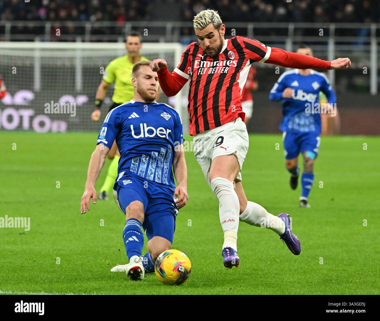 Milan, Italy. 15th Mar, 2025. AC Milan's Theo Hernandez (R) vies with ...